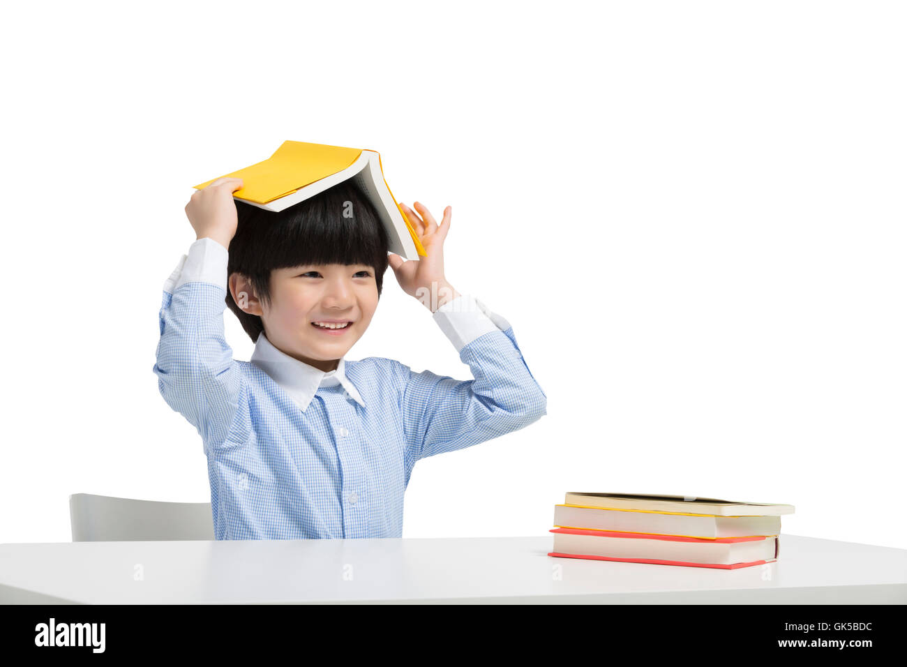 Little boy playing at the desk Stock Photo - Alamy