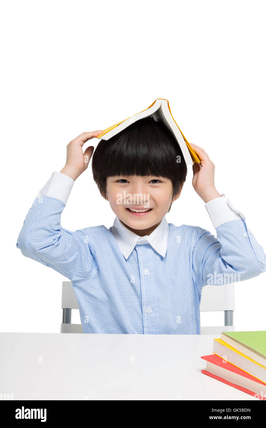 Little boy playing at the desk Stock Photo - Alamy