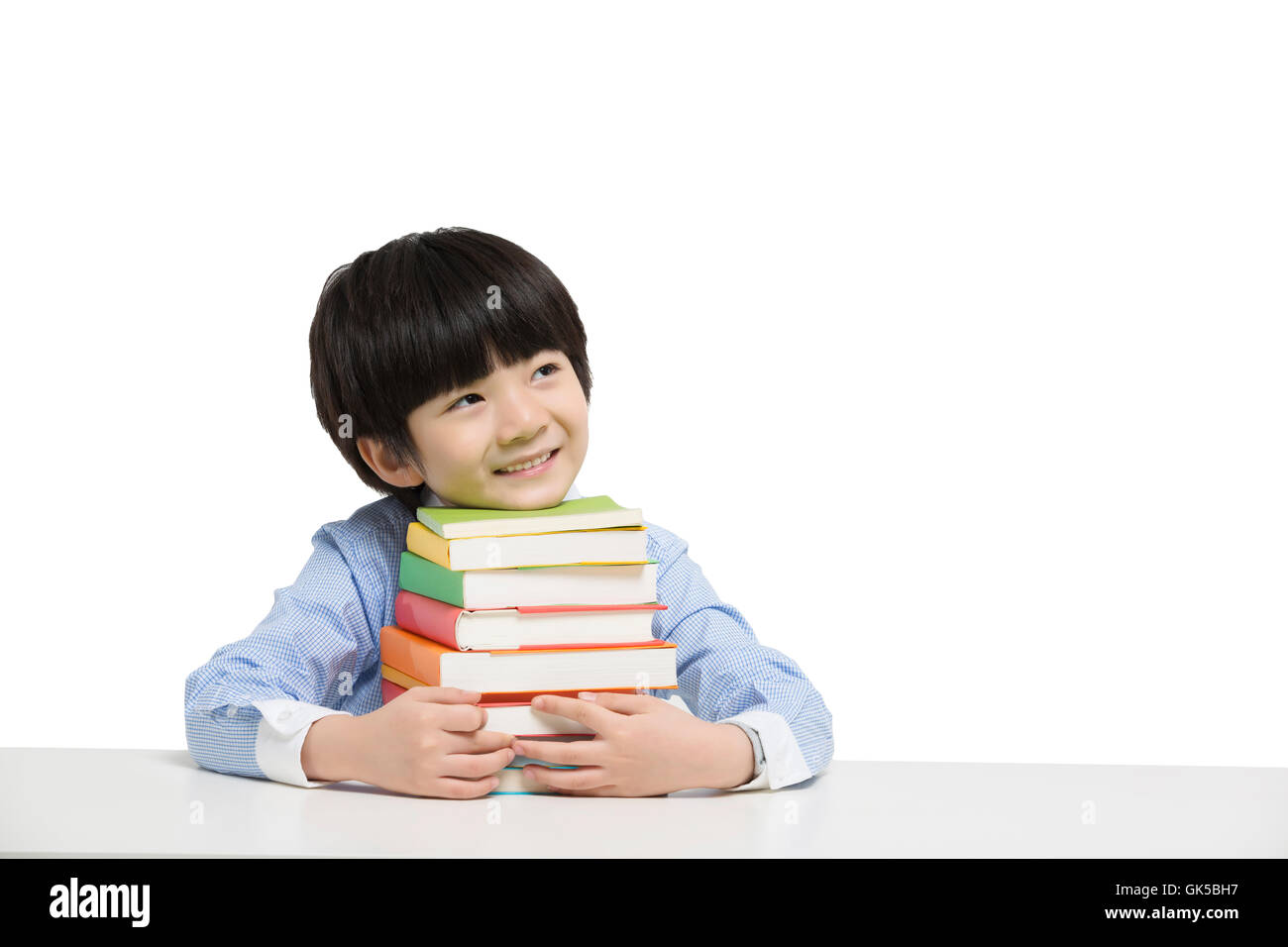 Little boy playing at the desk Stock Photo - Alamy