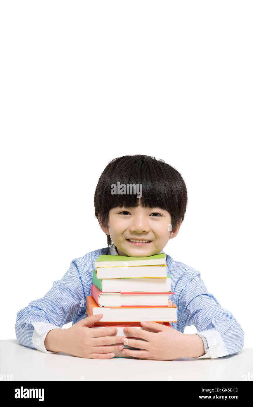 Little boy playing at the desk Stock Photo - Alamy