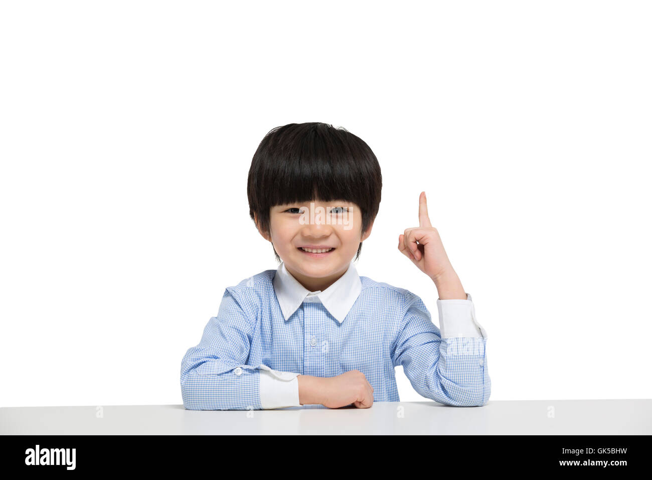 Little boy playing at the desk Stock Photo - Alamy