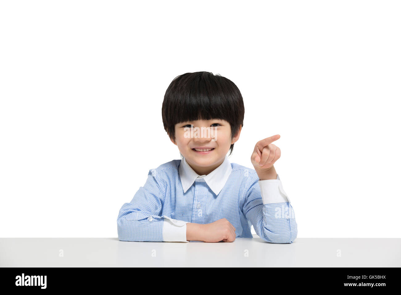 Little boy playing at the desk Stock Photo - Alamy