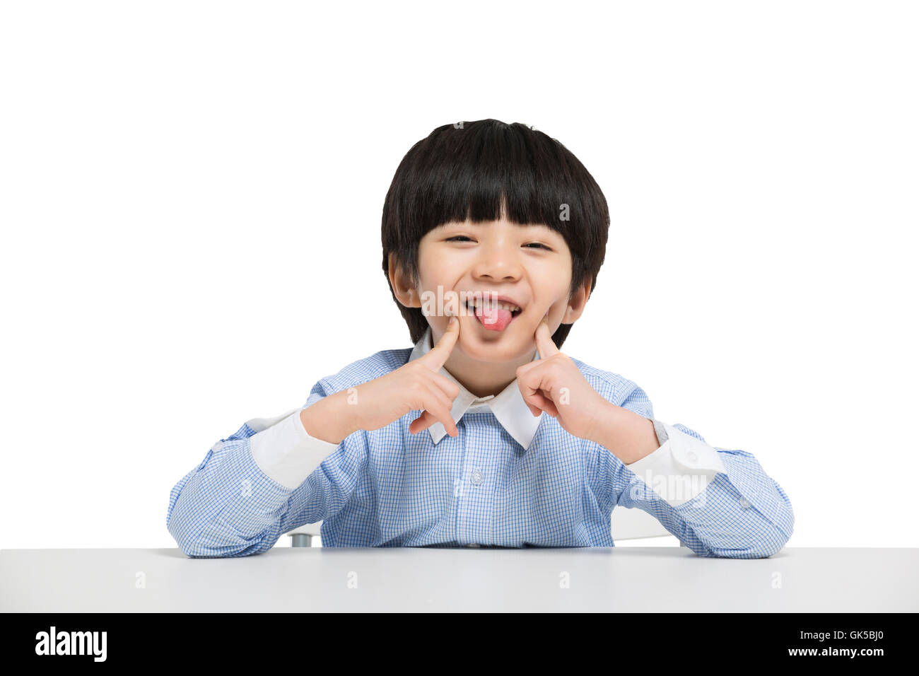 Little boy playing at the desk Stock Photo - Alamy