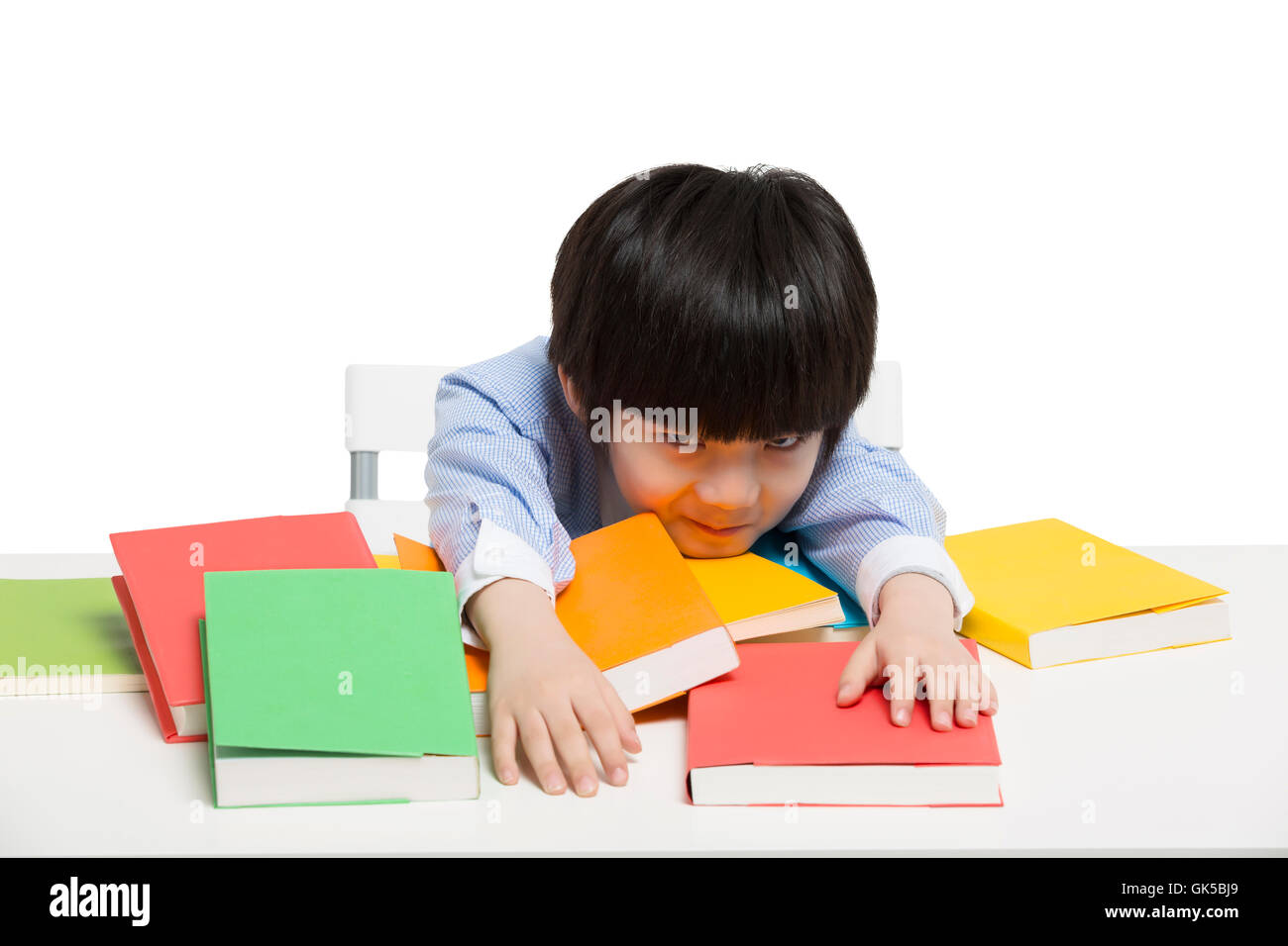 Little boy playing at the desk Stock Photo - Alamy