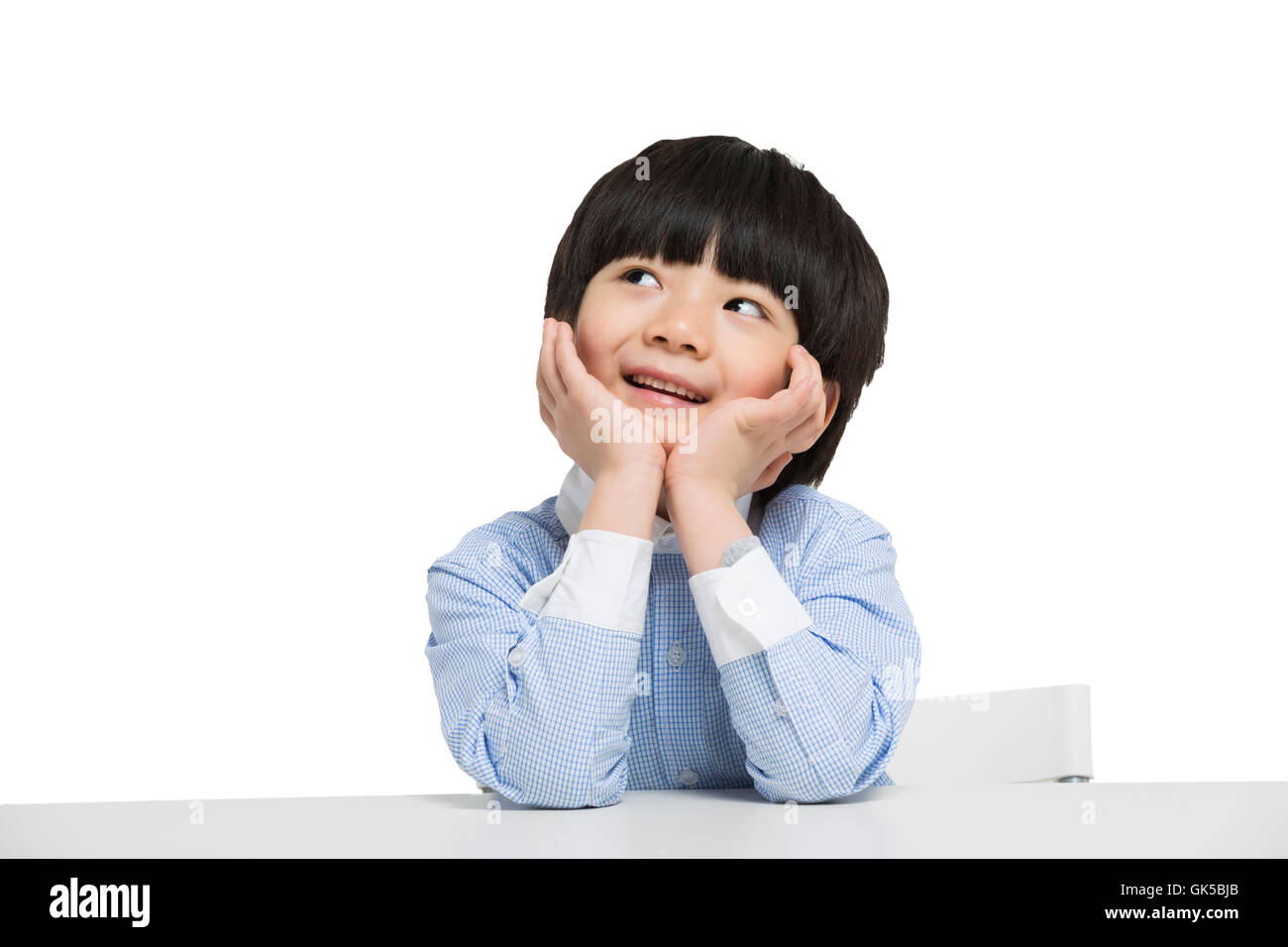 Little boy playing at the desk Stock Photo - Alamy