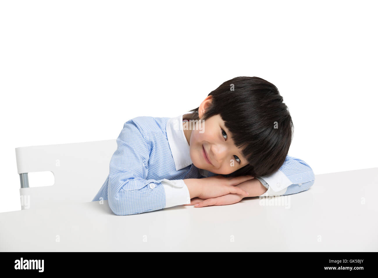 Little boy playing at the desk Stock Photo - Alamy