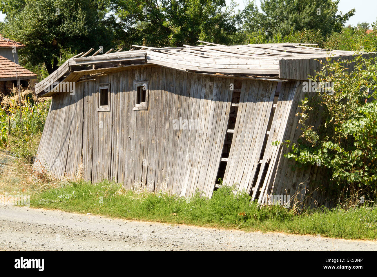 The old dilapidated wooden garden shed Stock Photo - Alamy