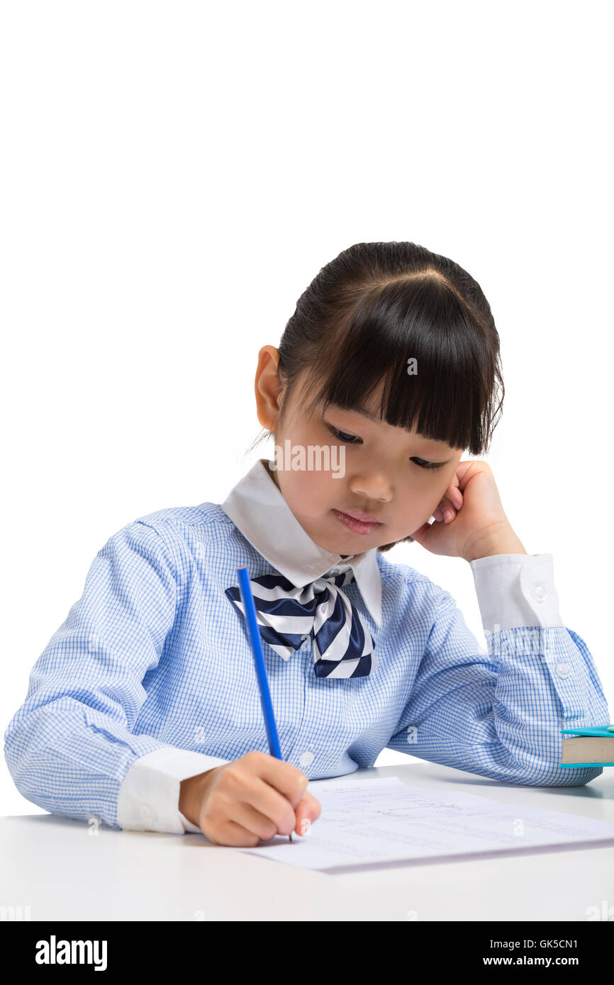The little girl playing in front of the desk Stock Photo - Alamy