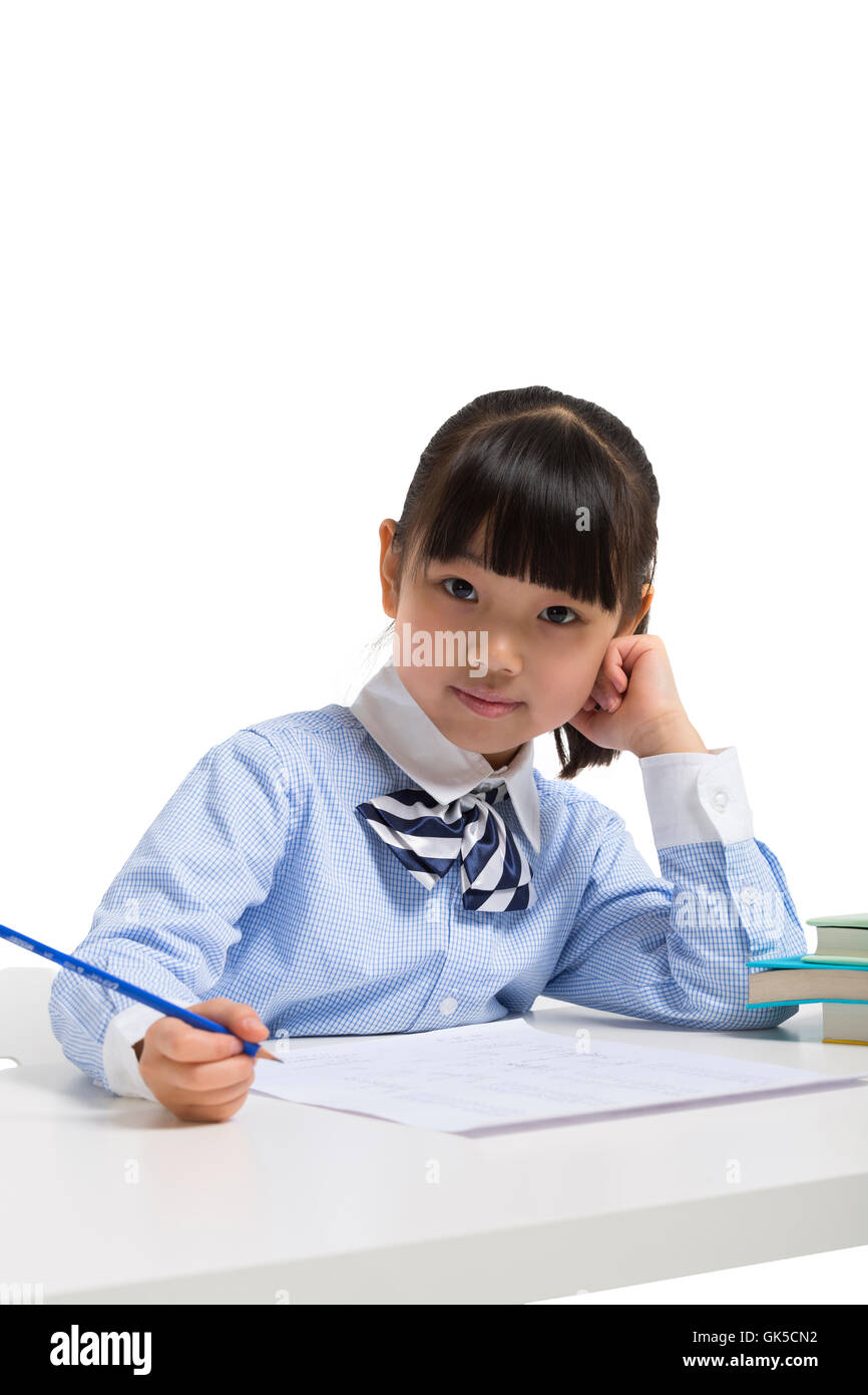 The little girl playing in front of the desk Stock Photo - Alamy