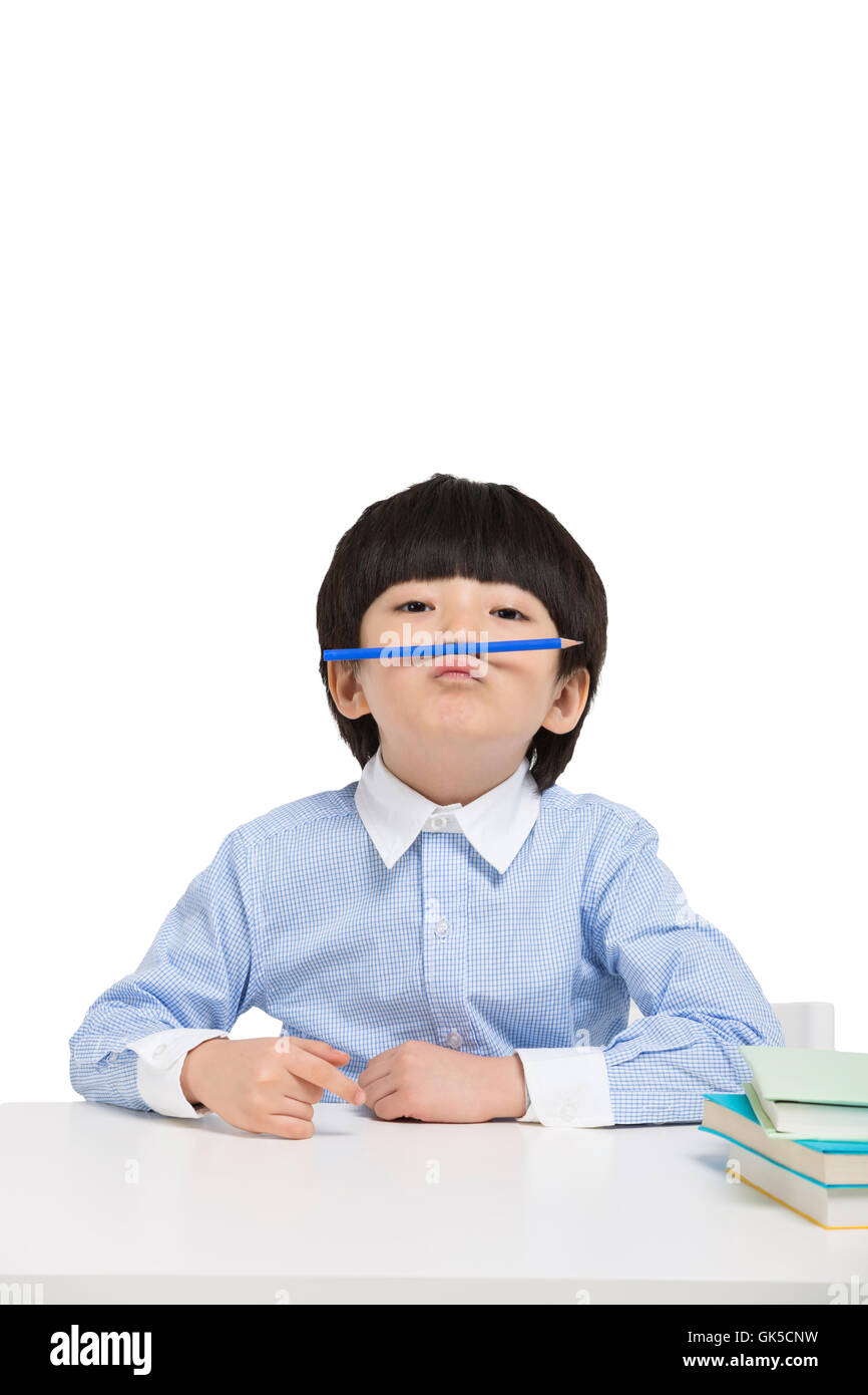Little boy playing at the desk Stock Photo - Alamy