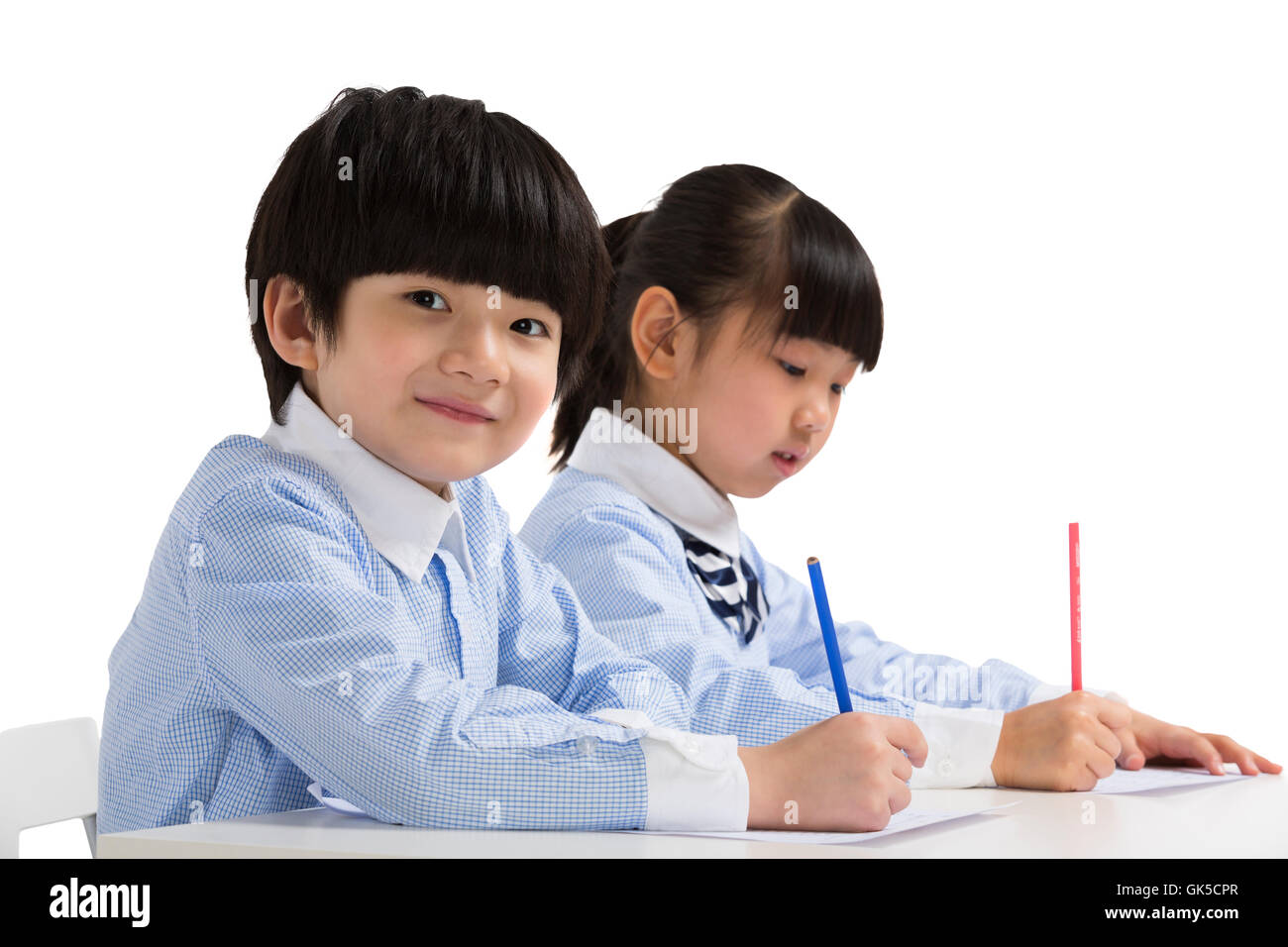 The little boy and the little girl in the study Stock Photo - Alamy