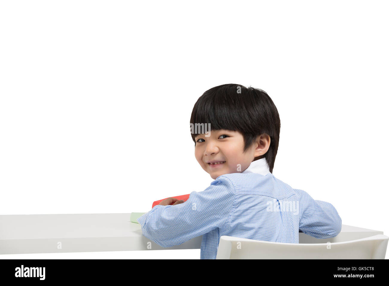 Little boy playing at the desk Stock Photo - Alamy