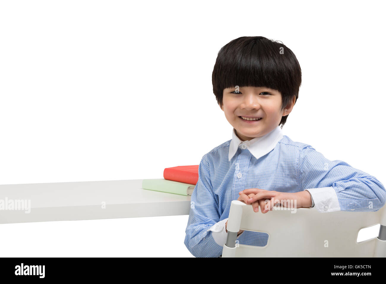 Little boy playing at the desk Stock Photo - Alamy