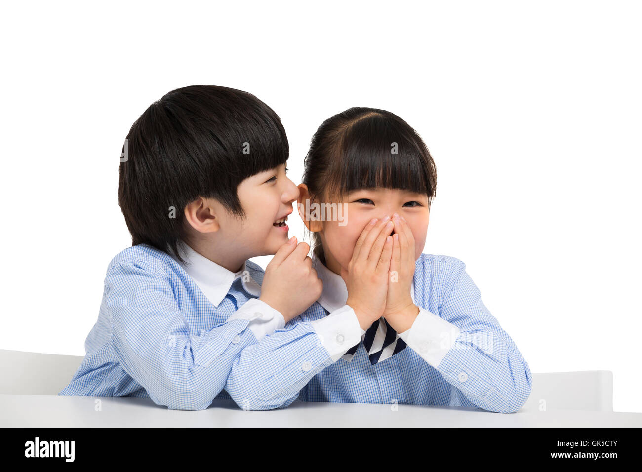 Little boys and girls whisper Stock Photo - Alamy