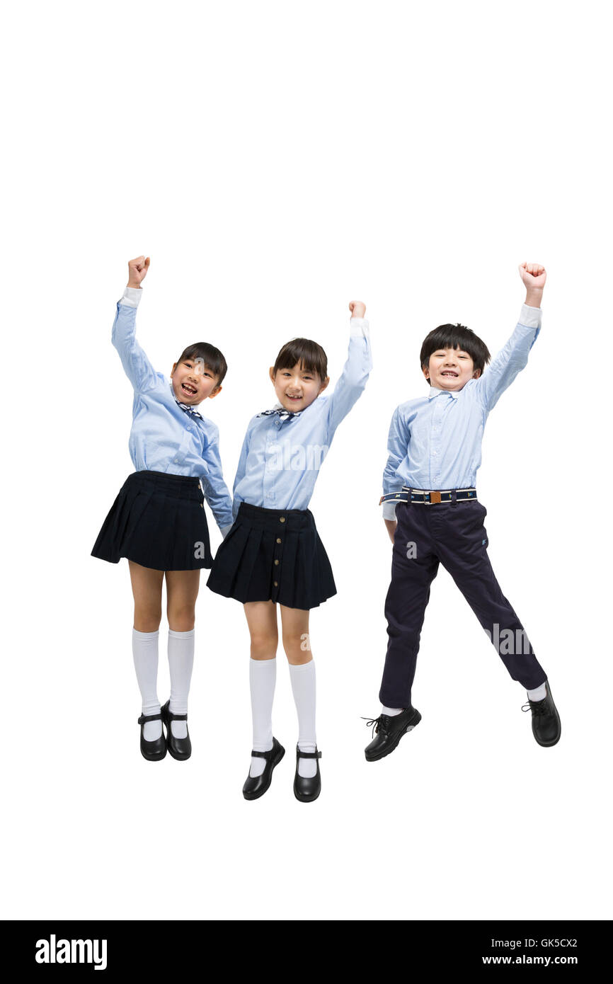 Children raised their hands jump Stock Photo - Alamy