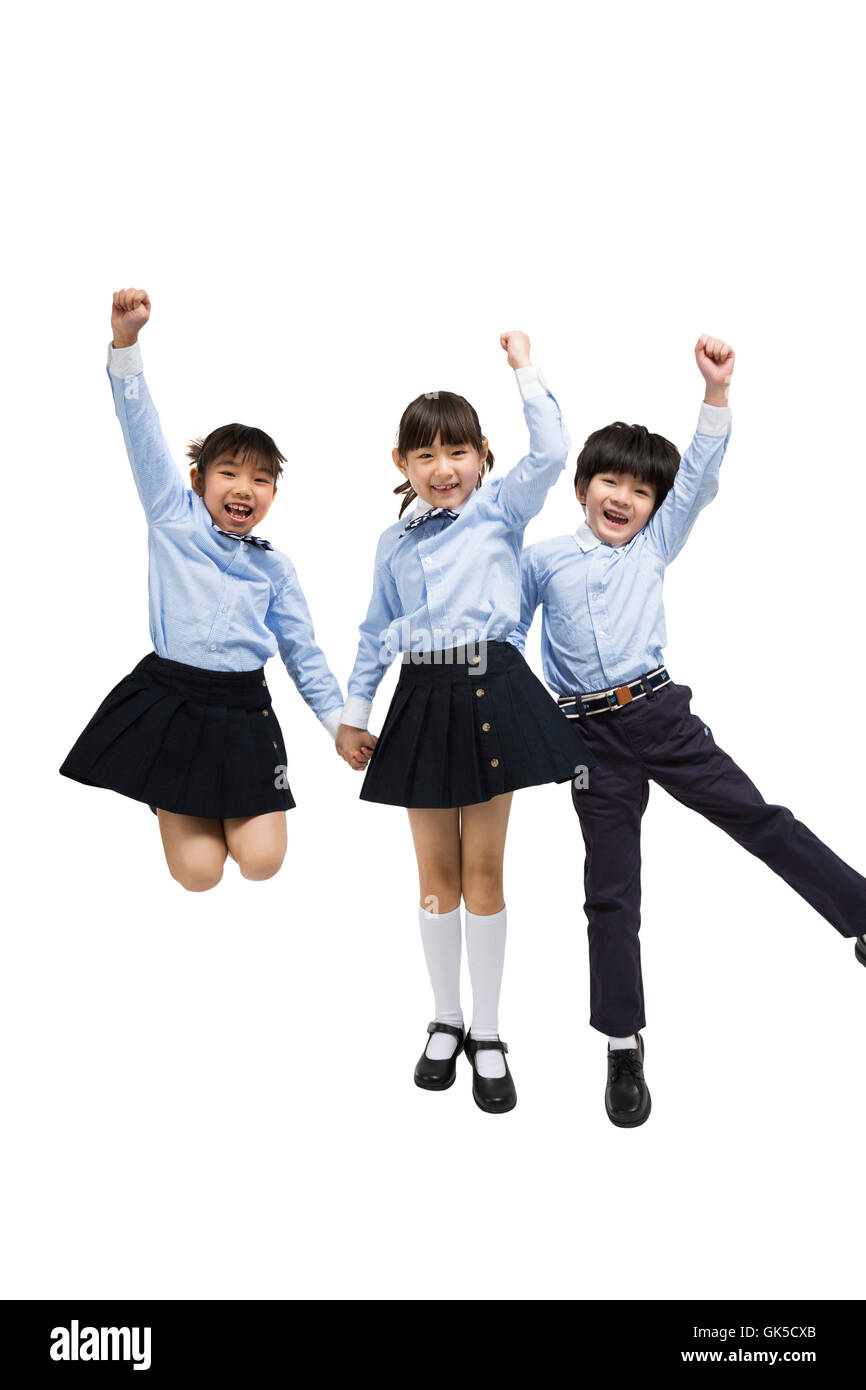 Children raised their hands jump Stock Photo - Alamy
