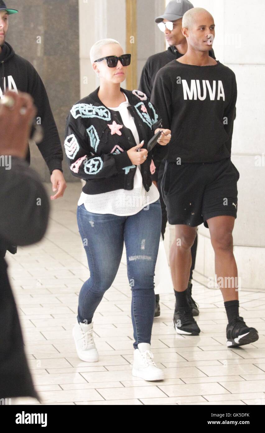 Amber Rose goes shopping at the Beverly Center with a posse of men ...