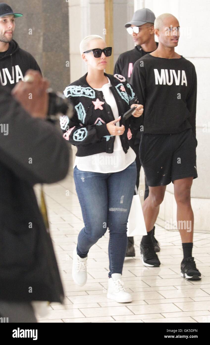 Amber Rose goes shopping at the Beverly Center with a posse of men ...