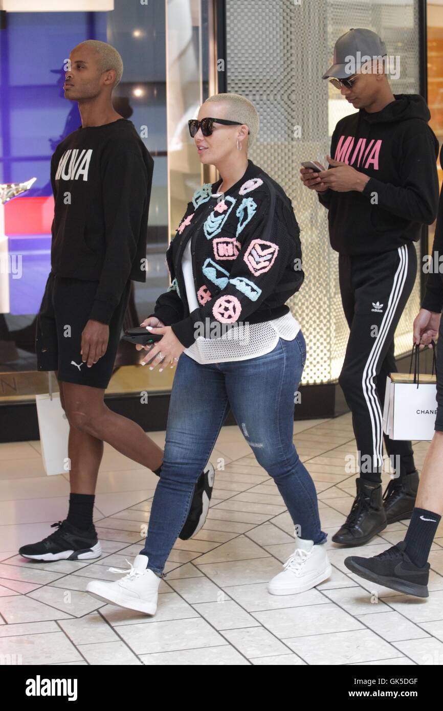 Amber Rose goes shopping at the Beverly Center with a posse of men ...