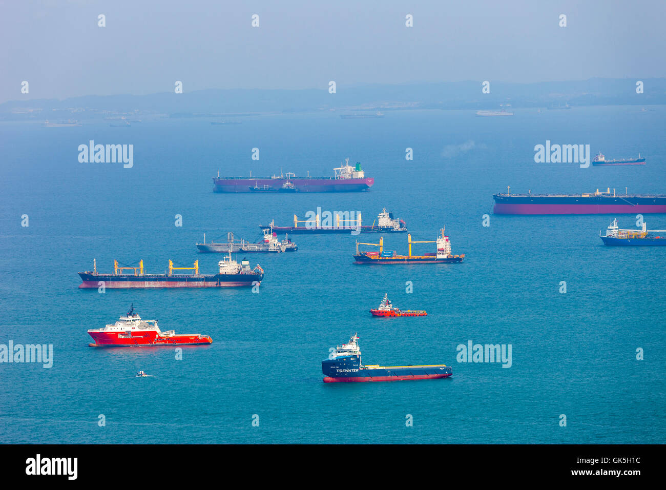 Commercial cargo ship at the anchorage to wait in a large collection of ...