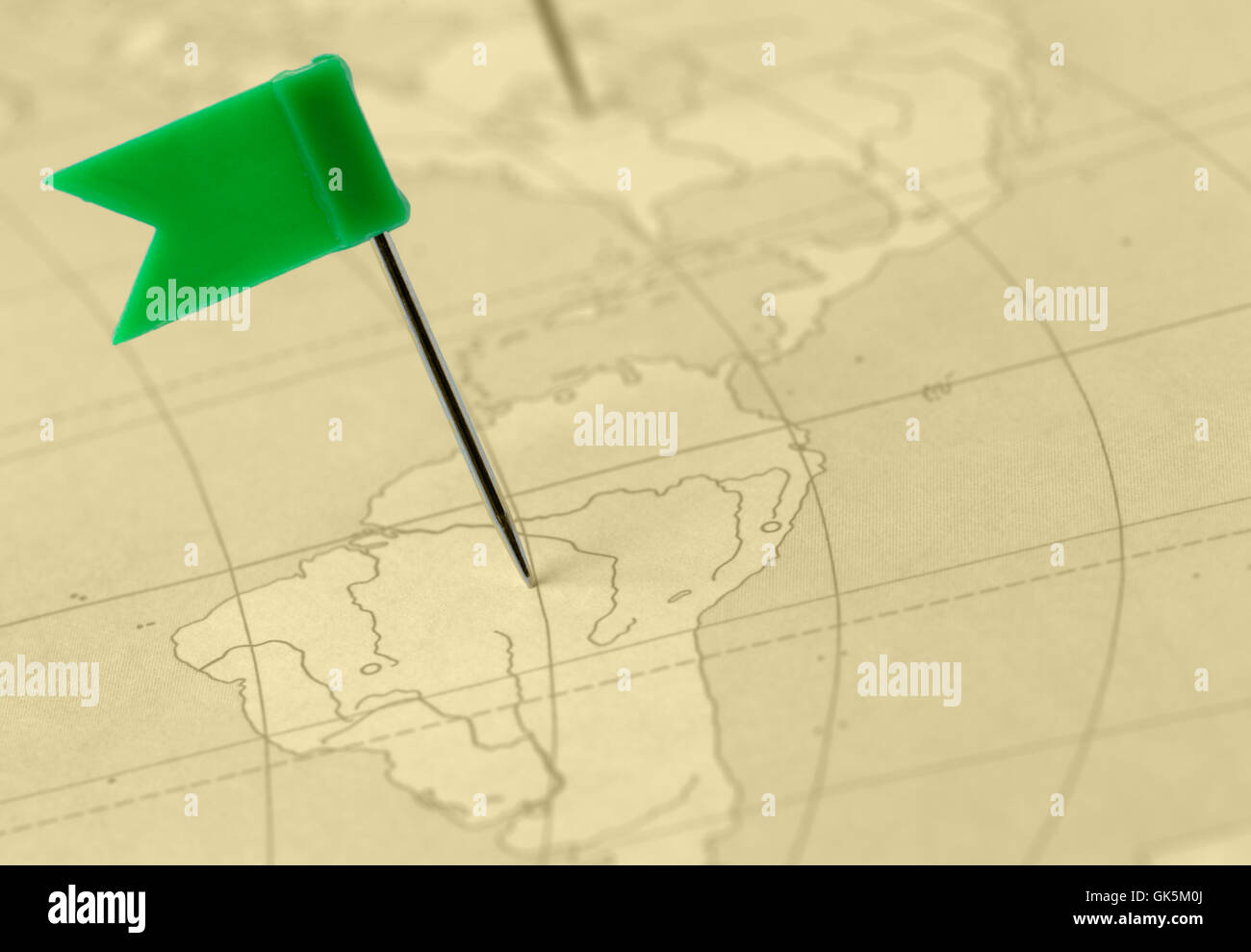 Flag green a pin on old map Stock Photo - Alamy