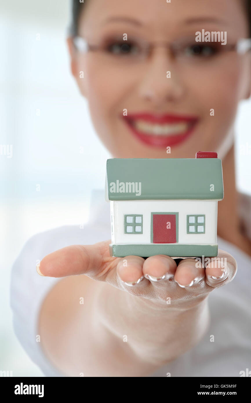 woman house building Stock Photo - Alamy