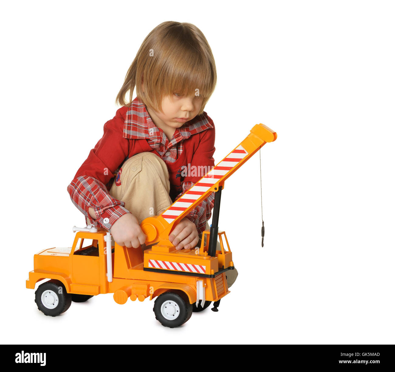 Boy with yellow toy crane hi-res stock photography and images - Alamy