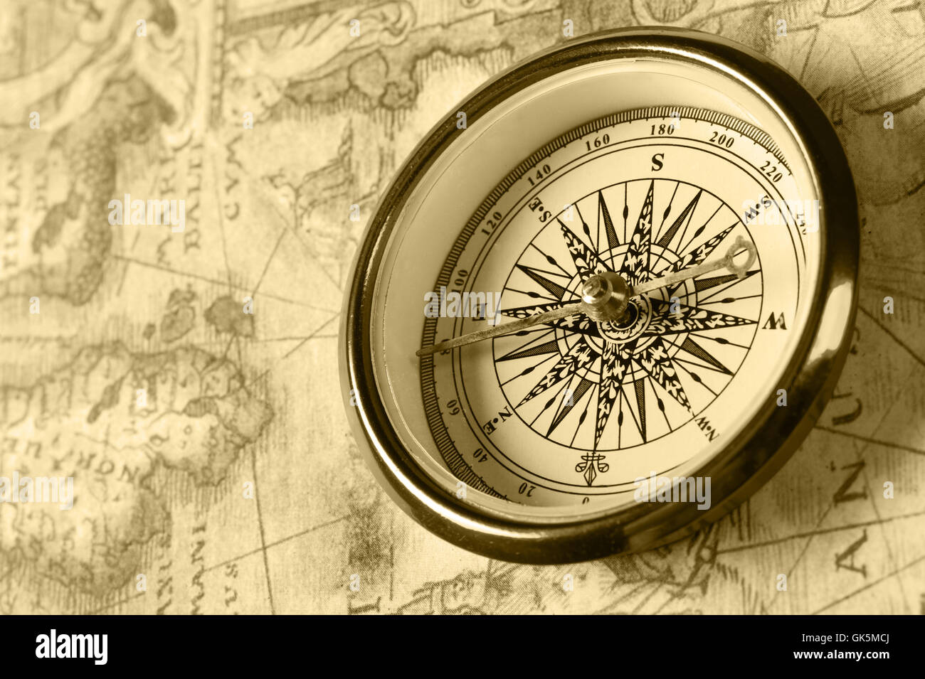 Old compass on ancient map Stock Photo - Alamy