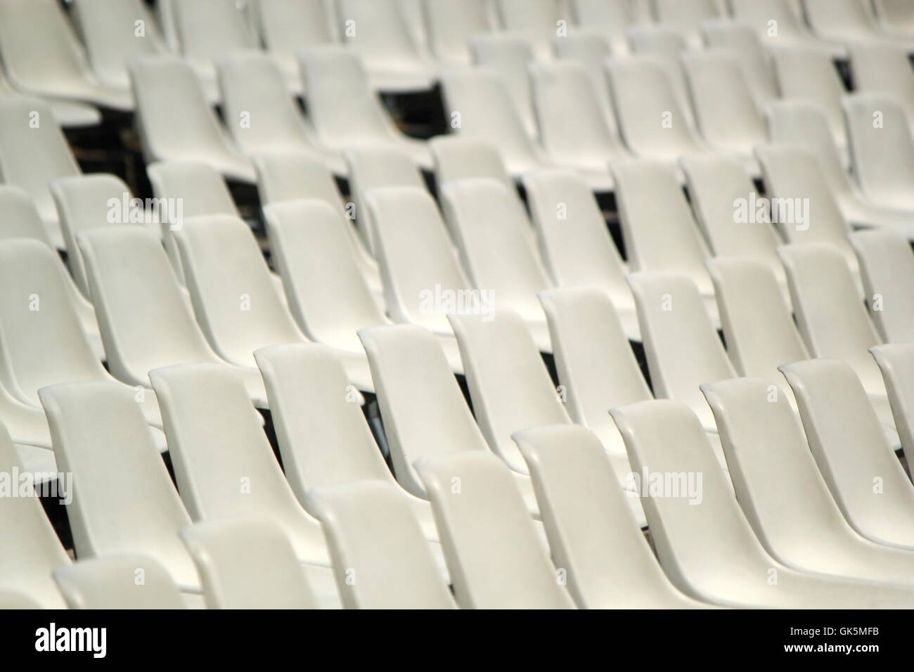 Array of white chairs Stock Photo - Alamy