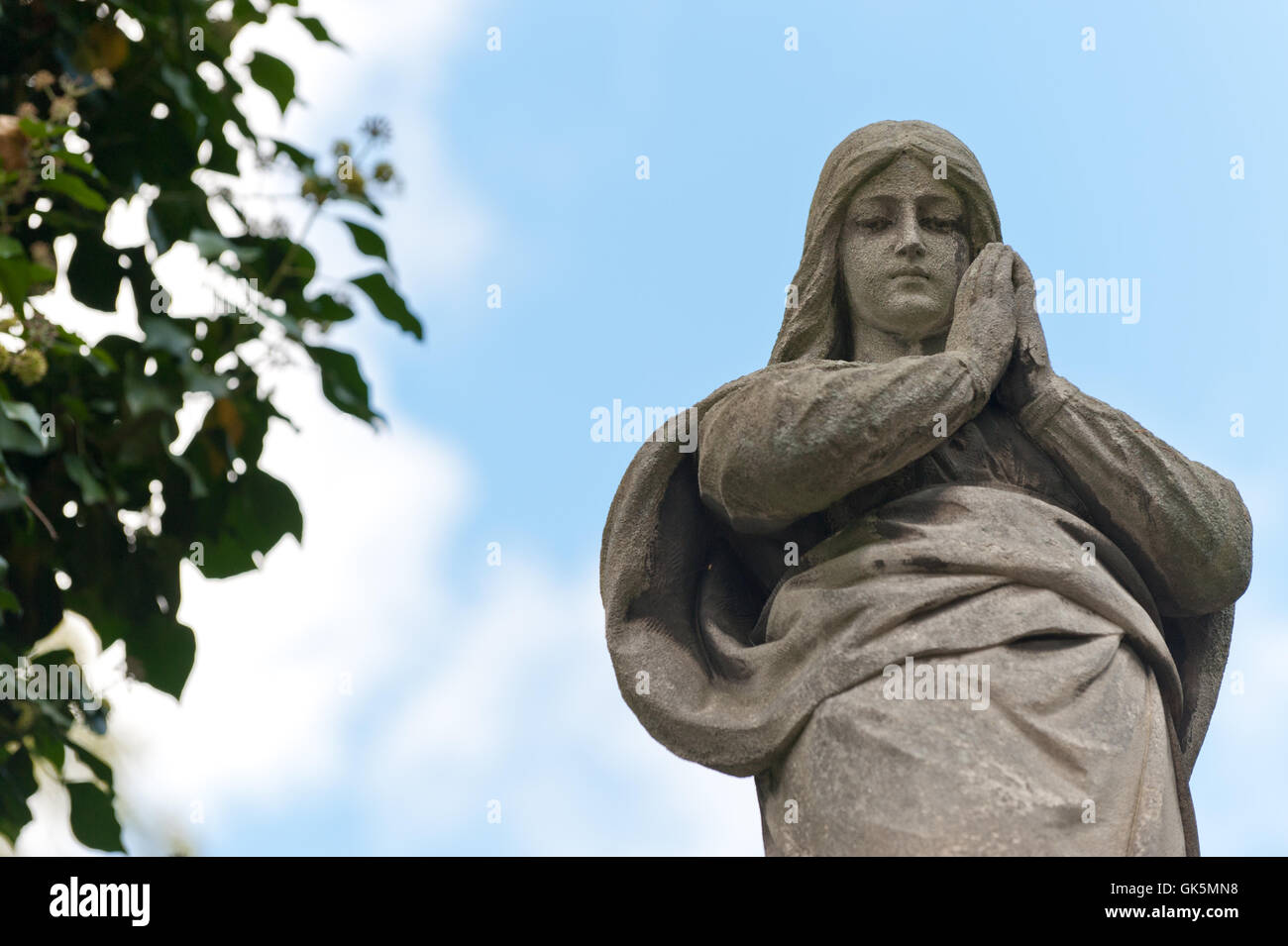Monument Lady of Guadalupe on a cemetery Stock Photo - Alamy