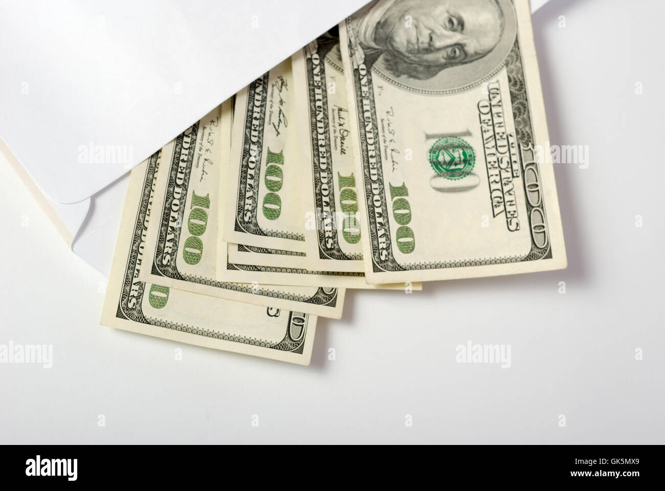 Bribe in an envelope white background Stock Photo - Alamy