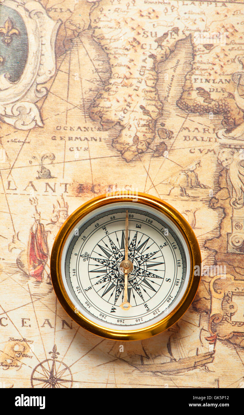 Old compass on ancient map Stock Photo - Alamy