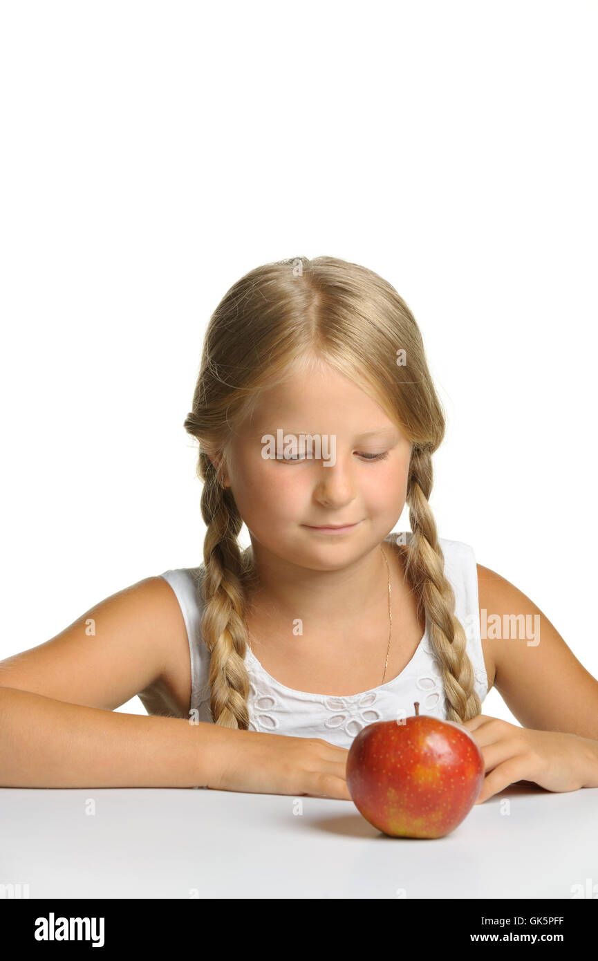 The pretty girl wishes to eat an apple Stock Photo - Alamy