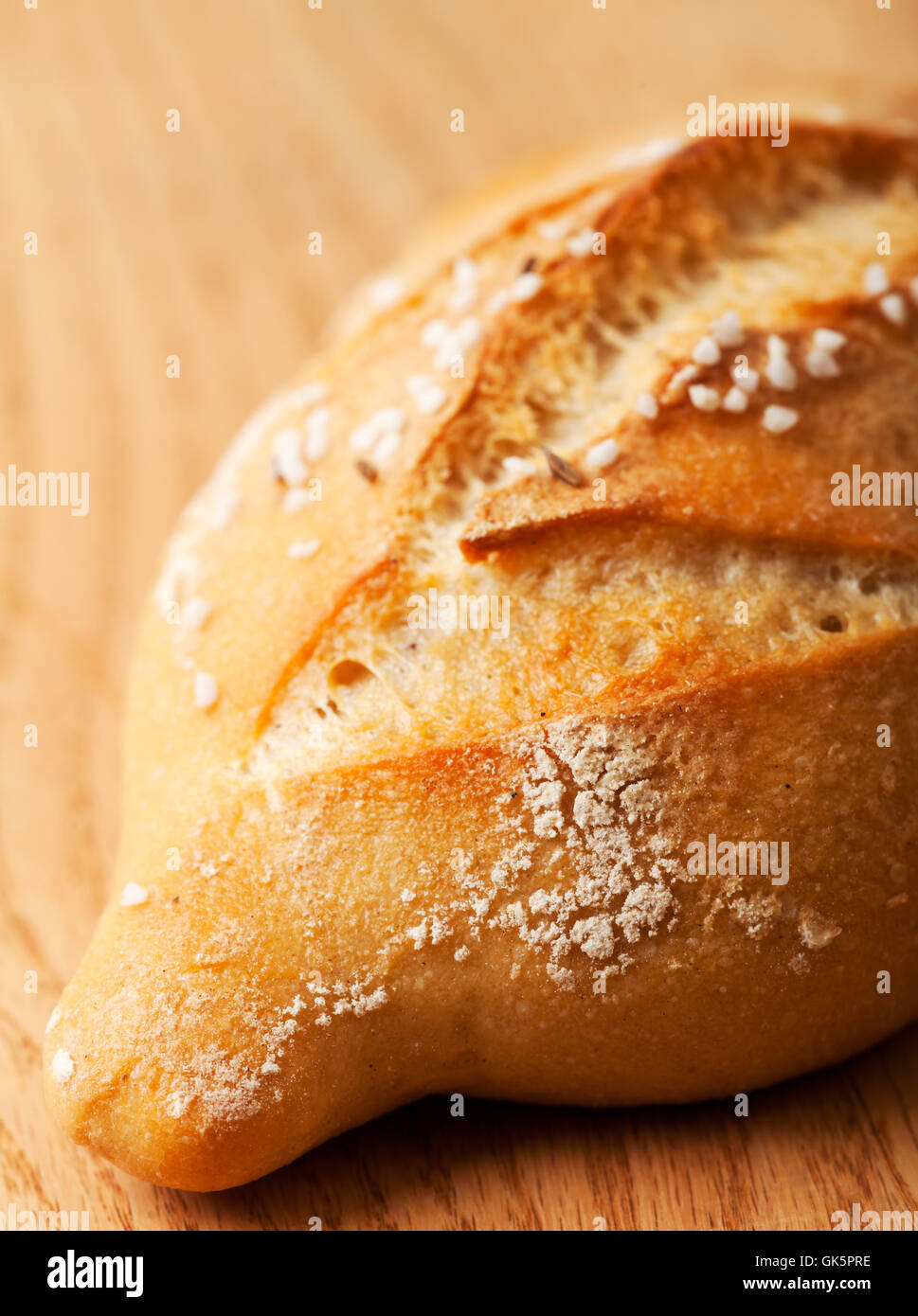 salted bun on an oak table Stock Photo - Alamy
