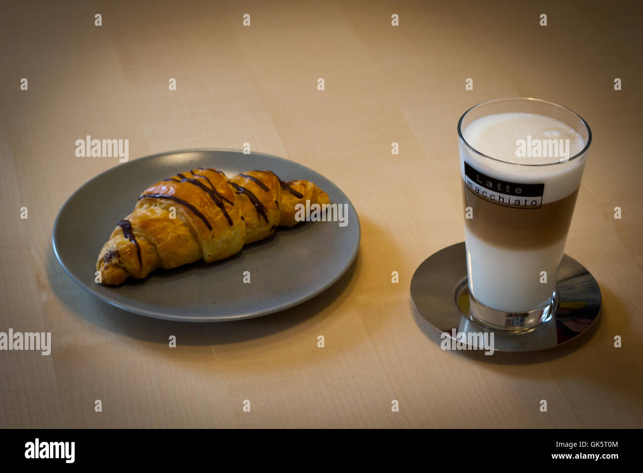 Latte macchiato with croissant Stock Photo - Alamy