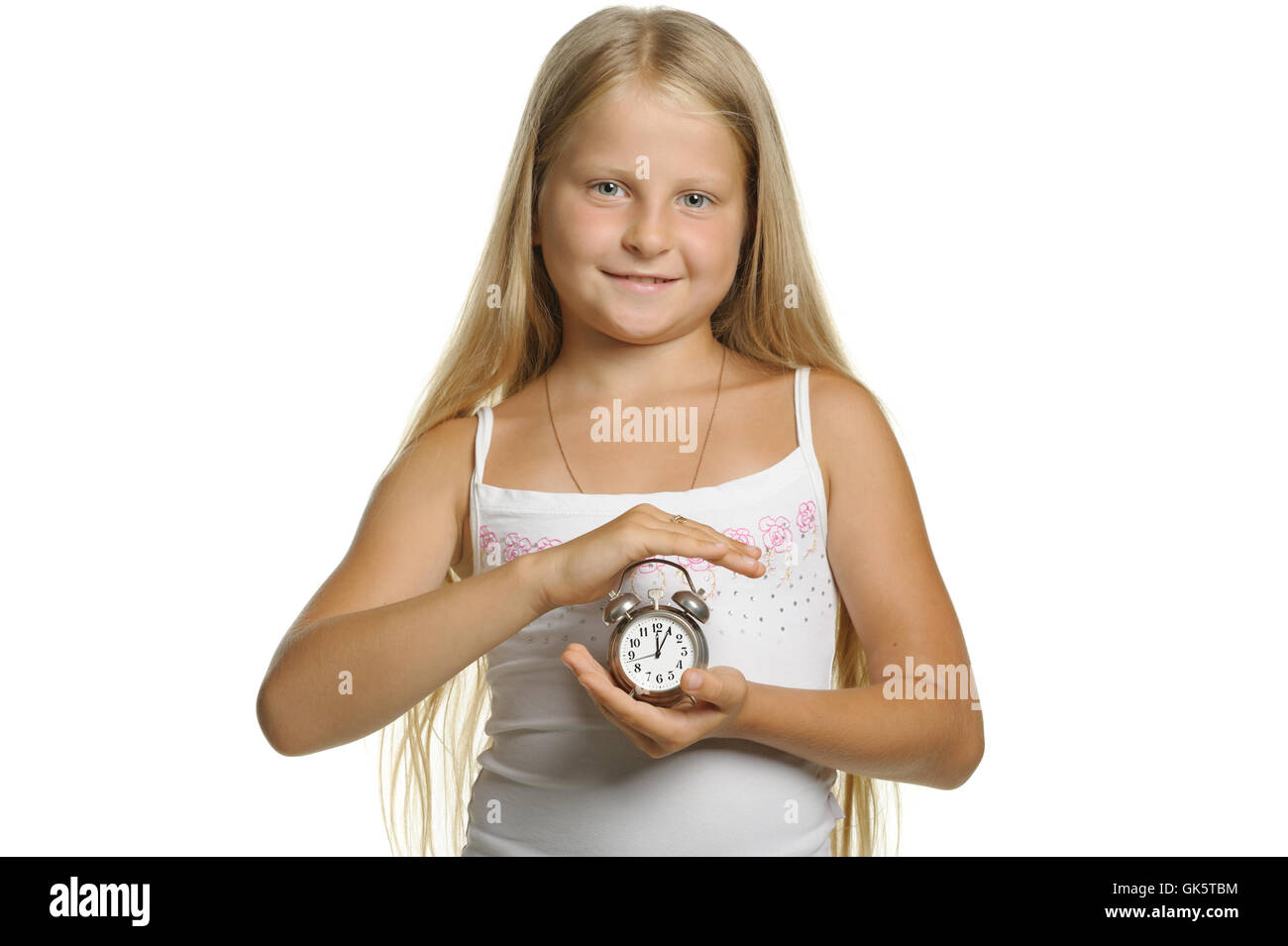 The girl holds an alarm clock in hands Stock Photo - Alamy
