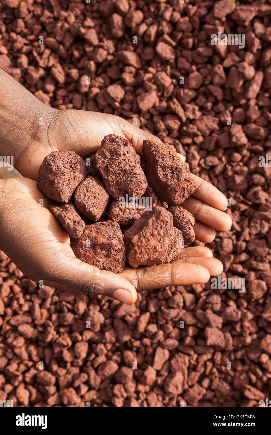 Transporting and managing iron ore. Close up of lump hematite iron ore ...