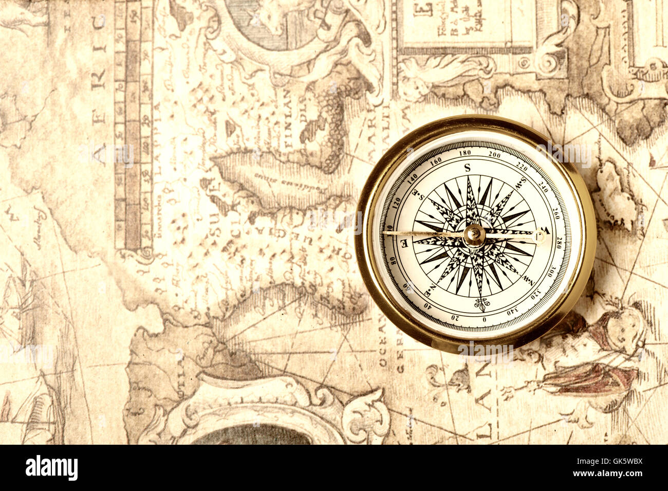 Old compass on ancient map Stock Photo - Alamy