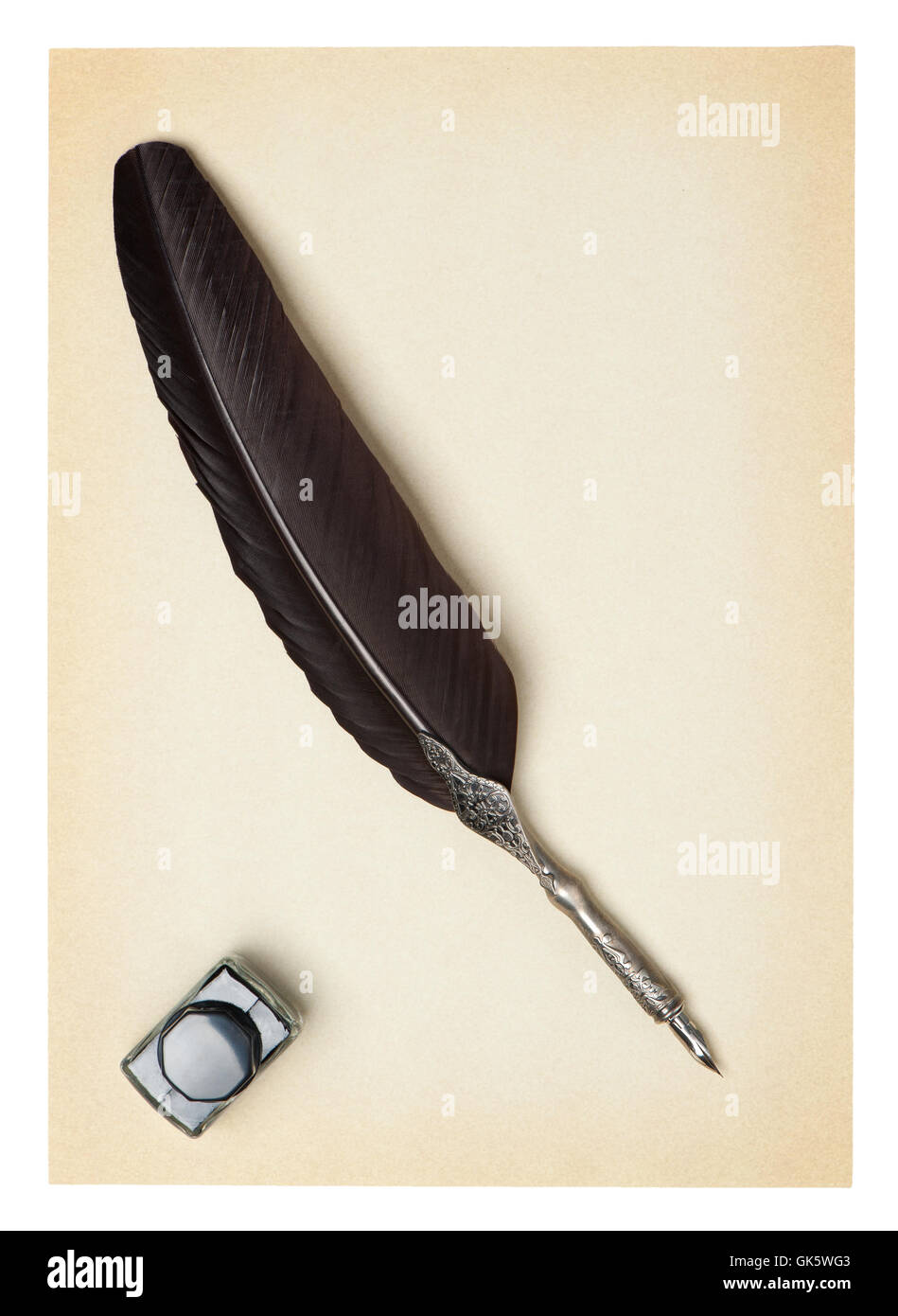 Feather quill and inkwell on an old paper Stock Photo - Alamy
