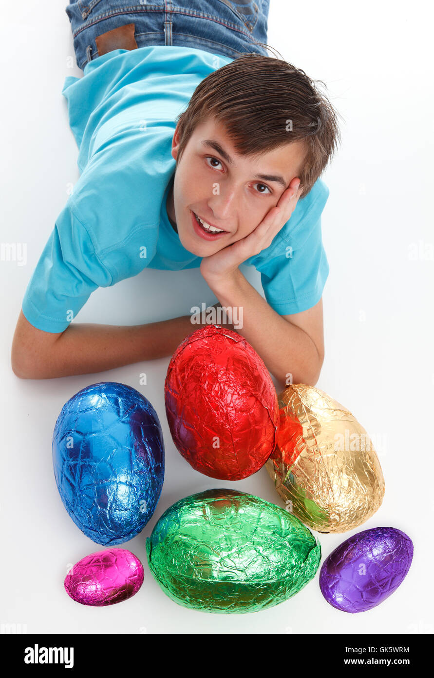 Boy with a bunch of chocolate easter eggs Stock Photo - Alamy