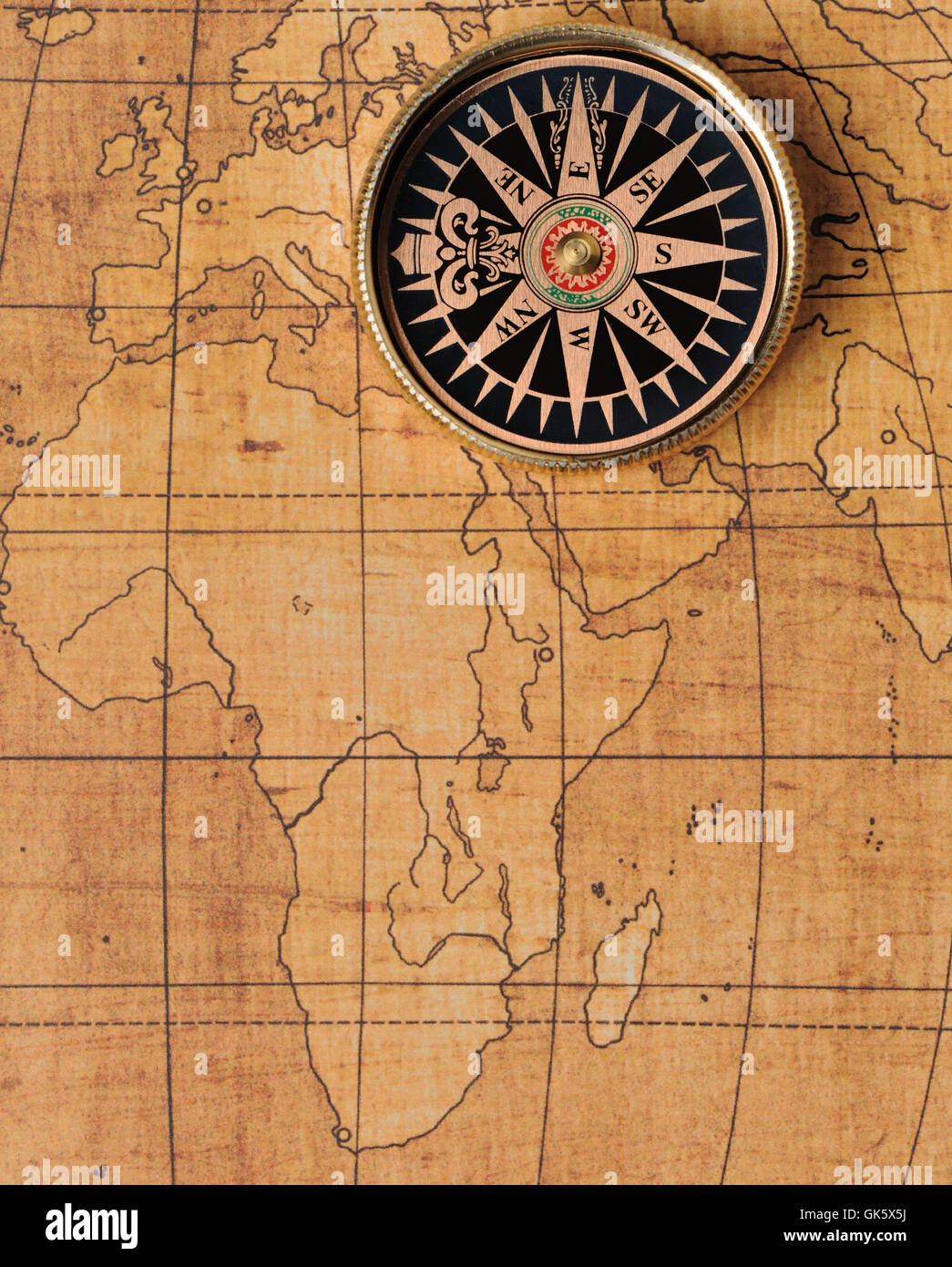 Old compass and map Stock Photo - Alamy