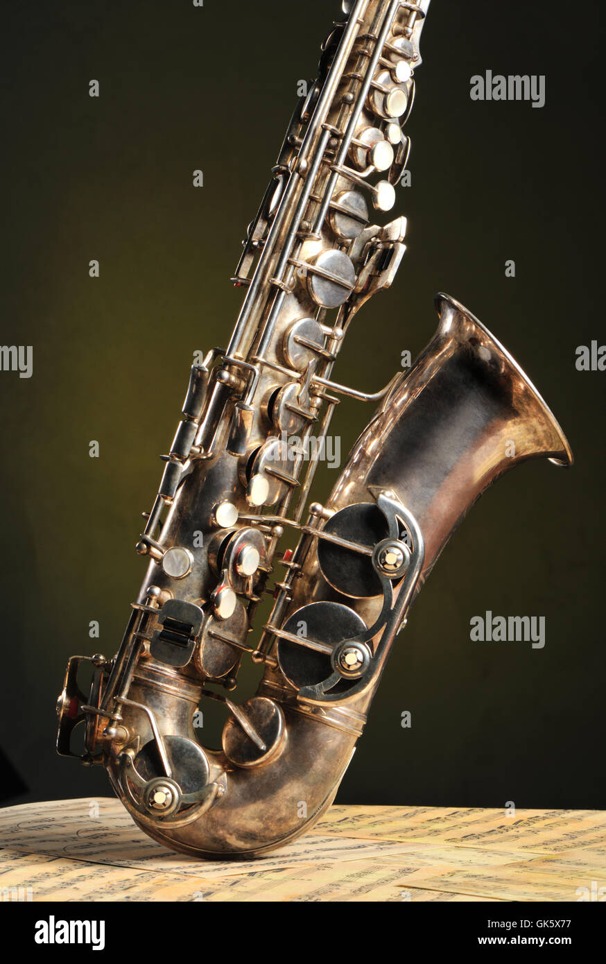 Old saxophone and notes Stock Photo - Alamy