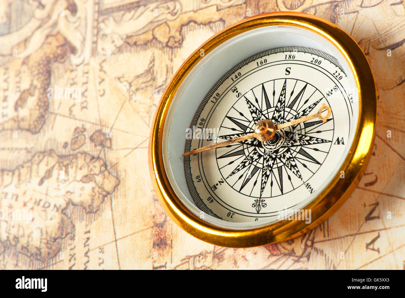 Old compass on ancient map Stock Photo - Alamy