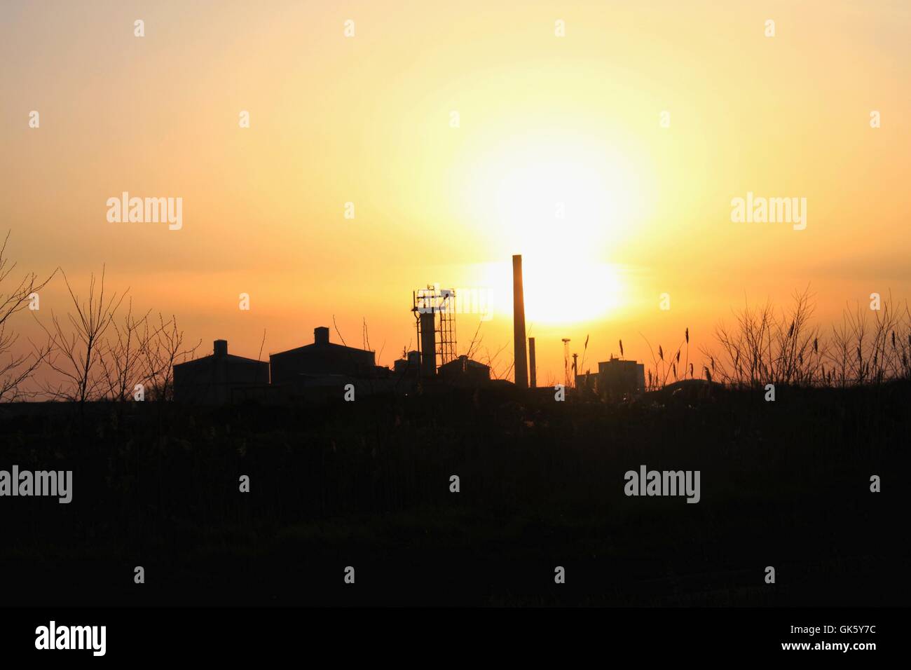 Factory in sunset Stock Photo - Alamy