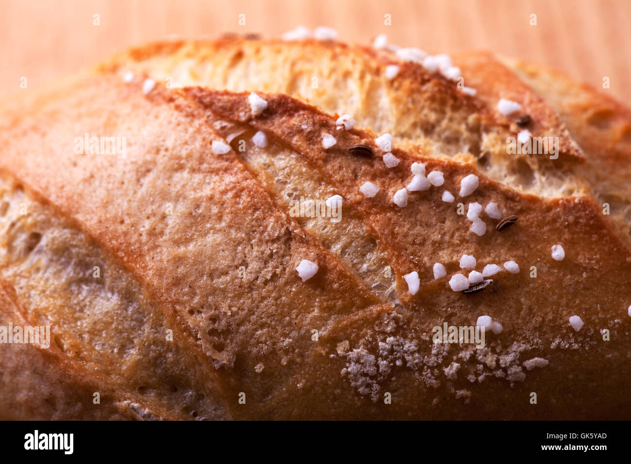 salted bun on an oak table Stock Photo - Alamy