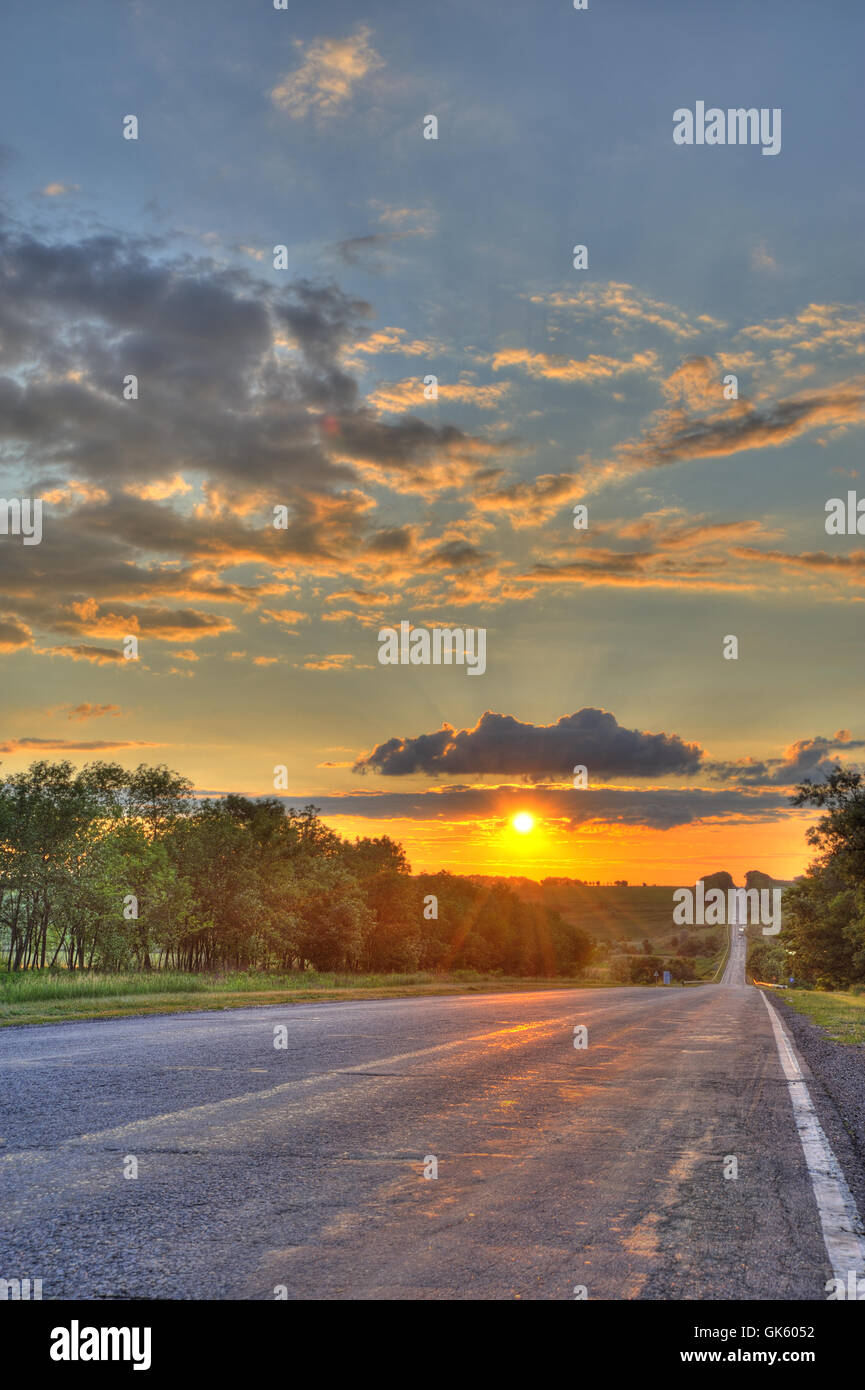 Road and sunset Stock Photo - Alamy