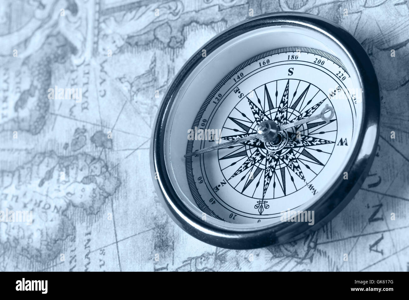 Old compass on ancient map Stock Photo - Alamy