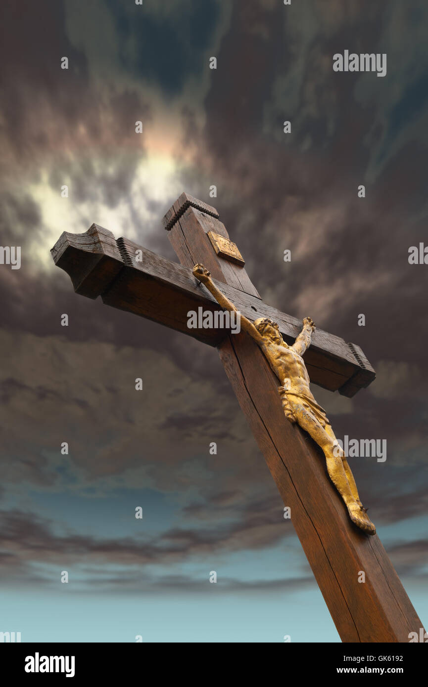The crucifixion from a tree with Jesus's gilt figure Stock Photo - Alamy