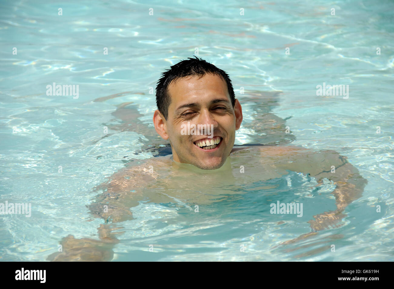 Happy man in pool Stock Photo - Alamy