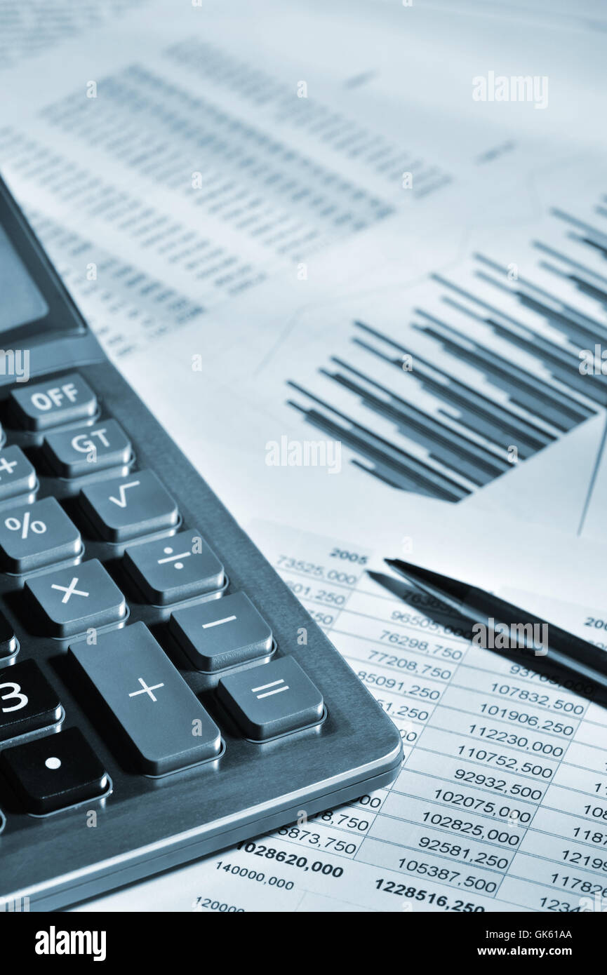 The calculator and the financial report Stock Photo - Alamy